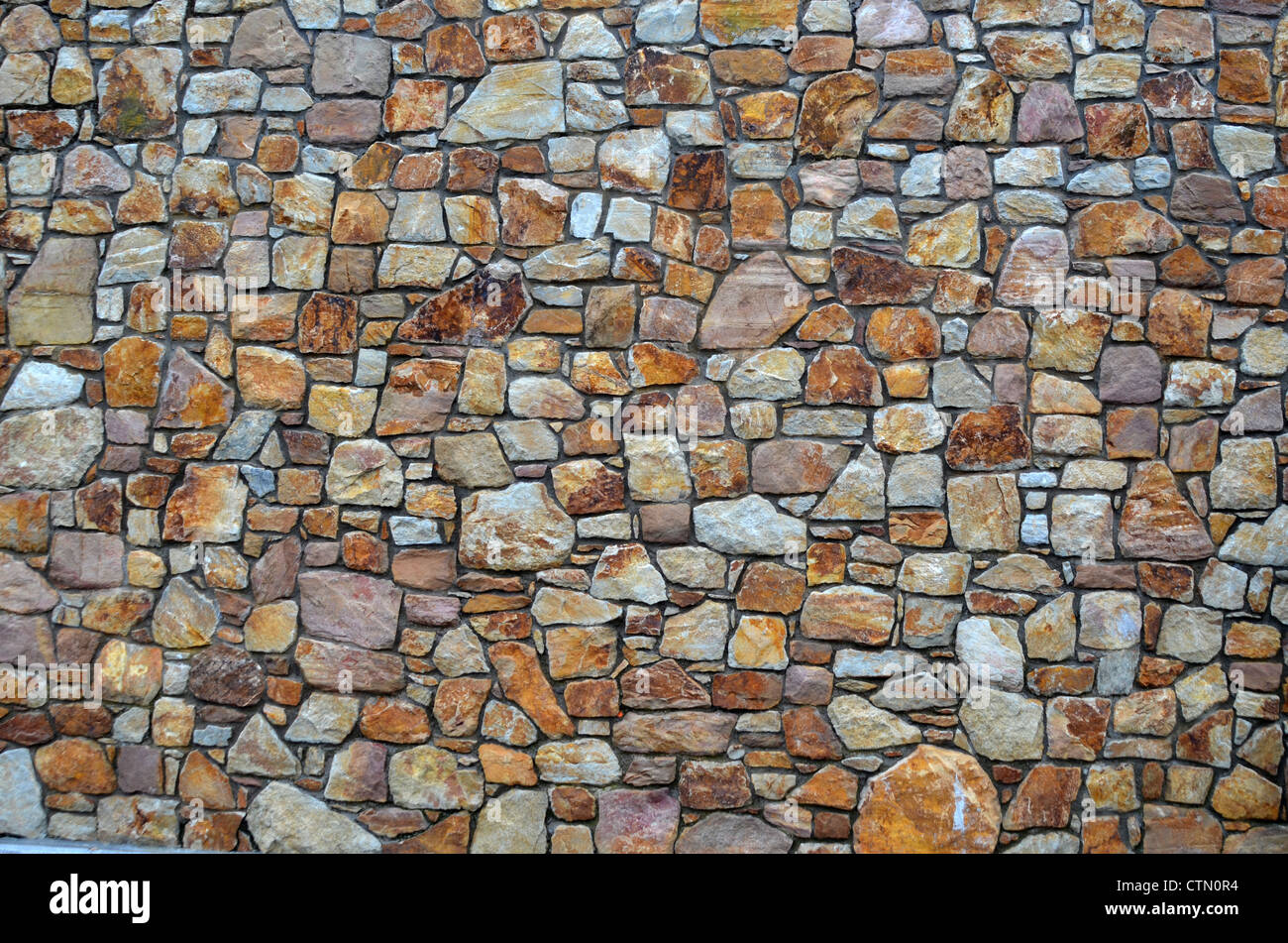 stone wall of natural stones also to use as background Stock Photo - Alamy