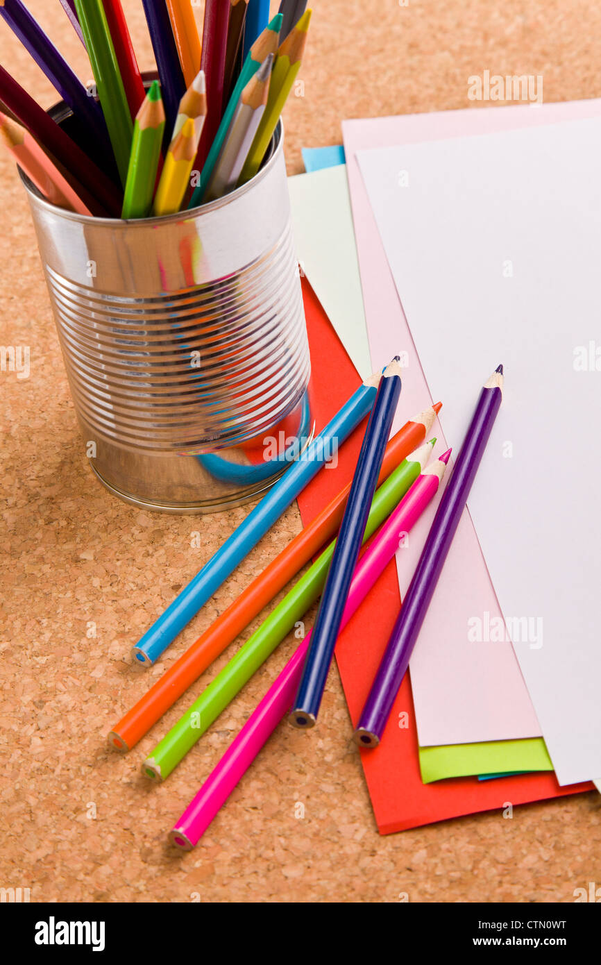 Colour pencils on office table Stock Photo - Alamy