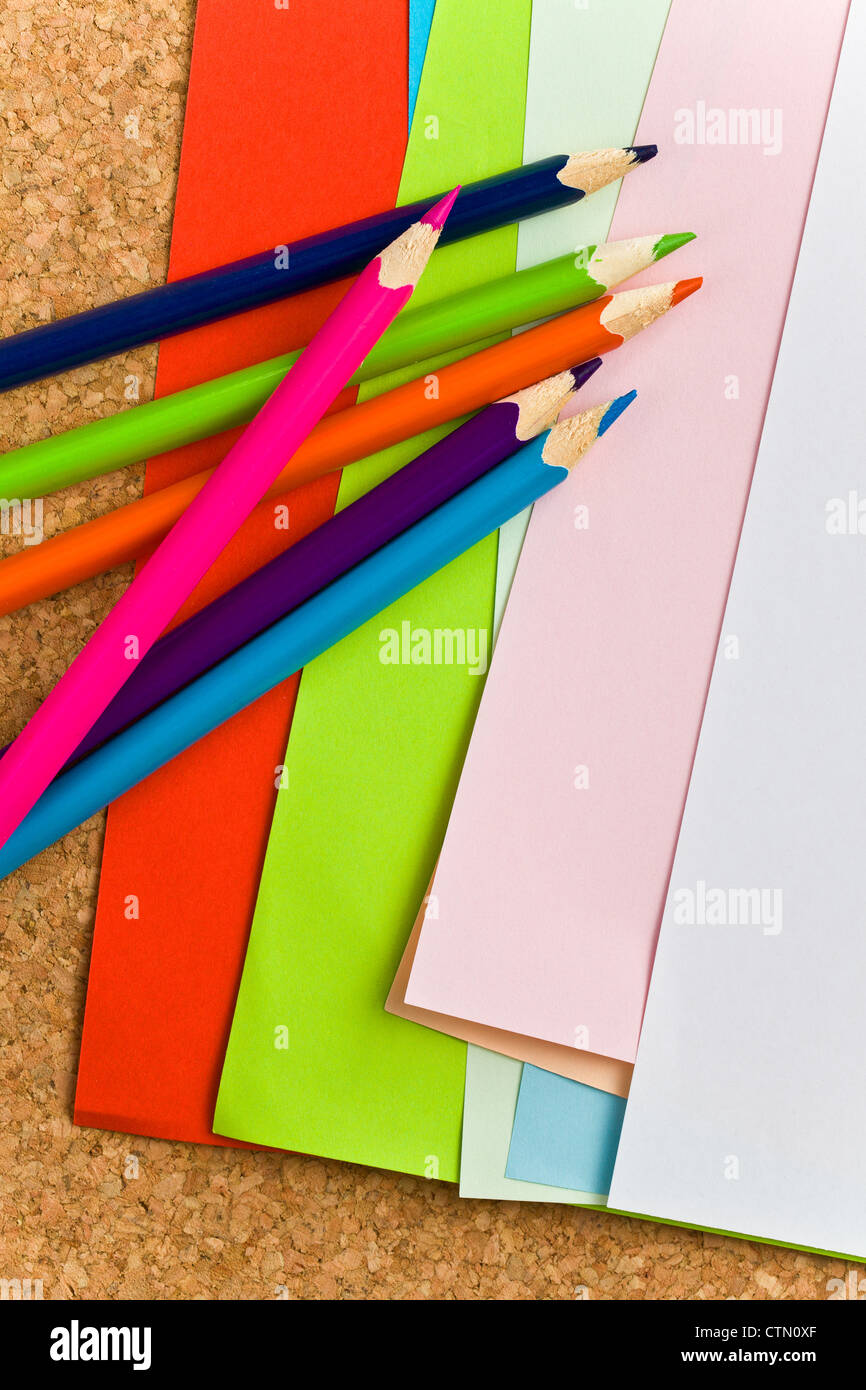 Colour pencils on office table Stock Photo - Alamy