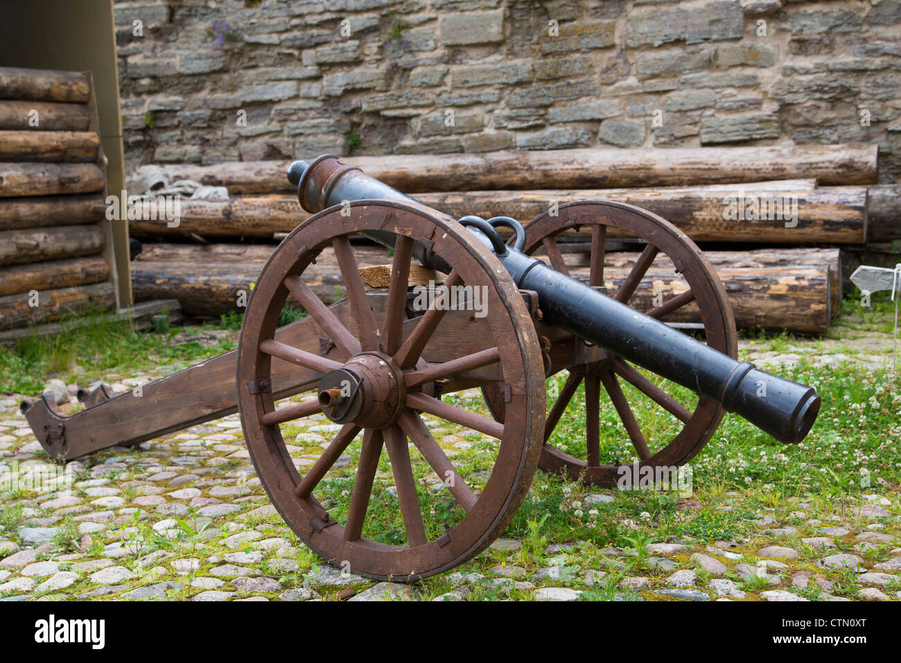 Ancient cannon made from cast iron on courtyard Stock Photo - Alamy