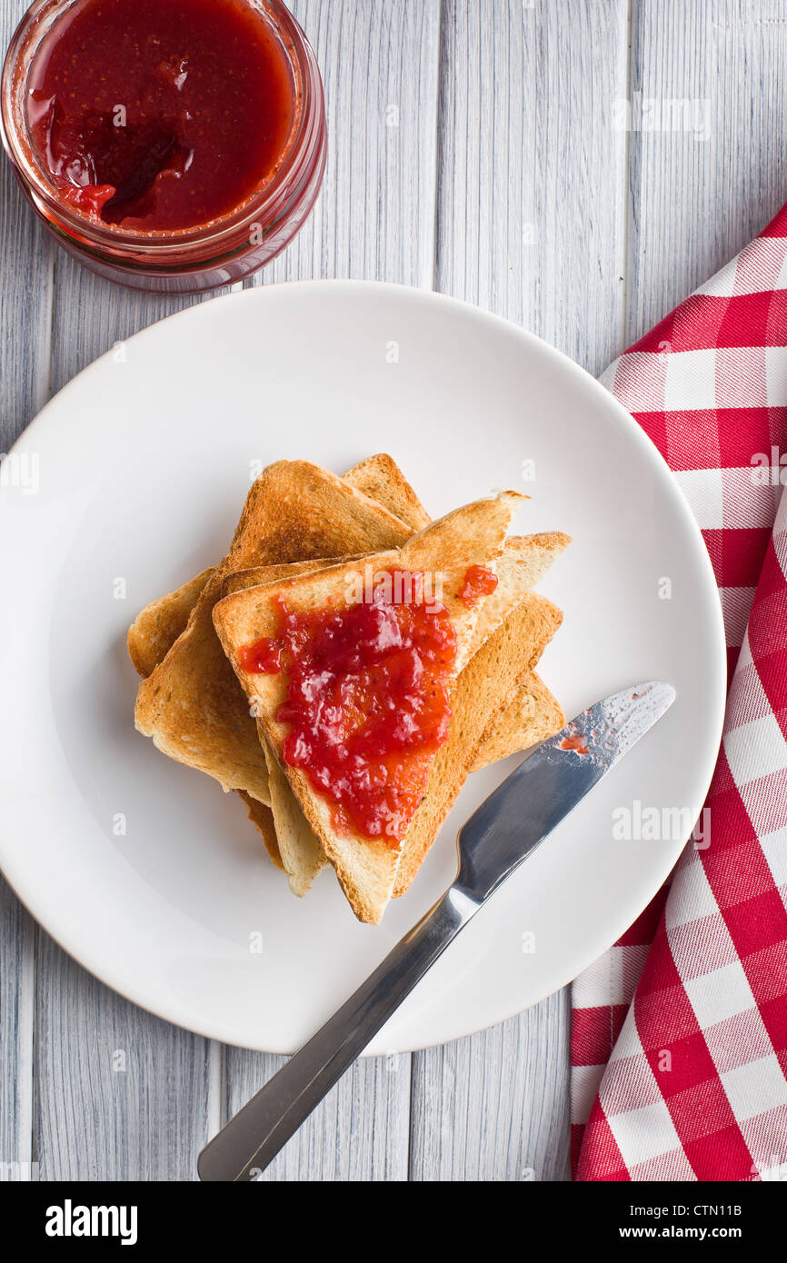 toast with jam on kitchen table Stock Photo - Alamy