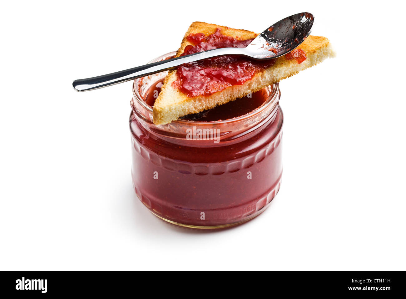 toast with jam in glass jar on white background Stock Photo - Alamy