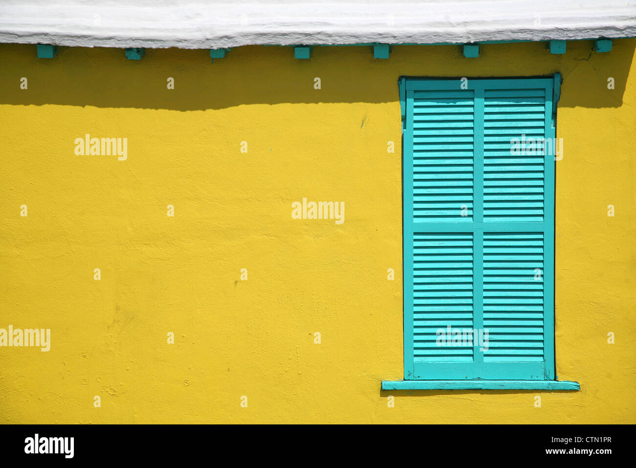 Contrasting window shutters against the interesting texture of a stucco ...