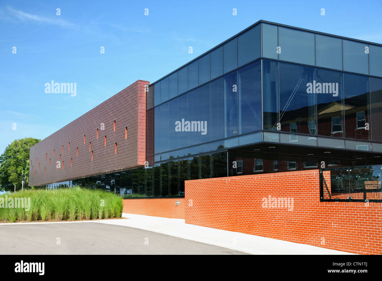 Large glass and brick office building Stock Photo - Alamy