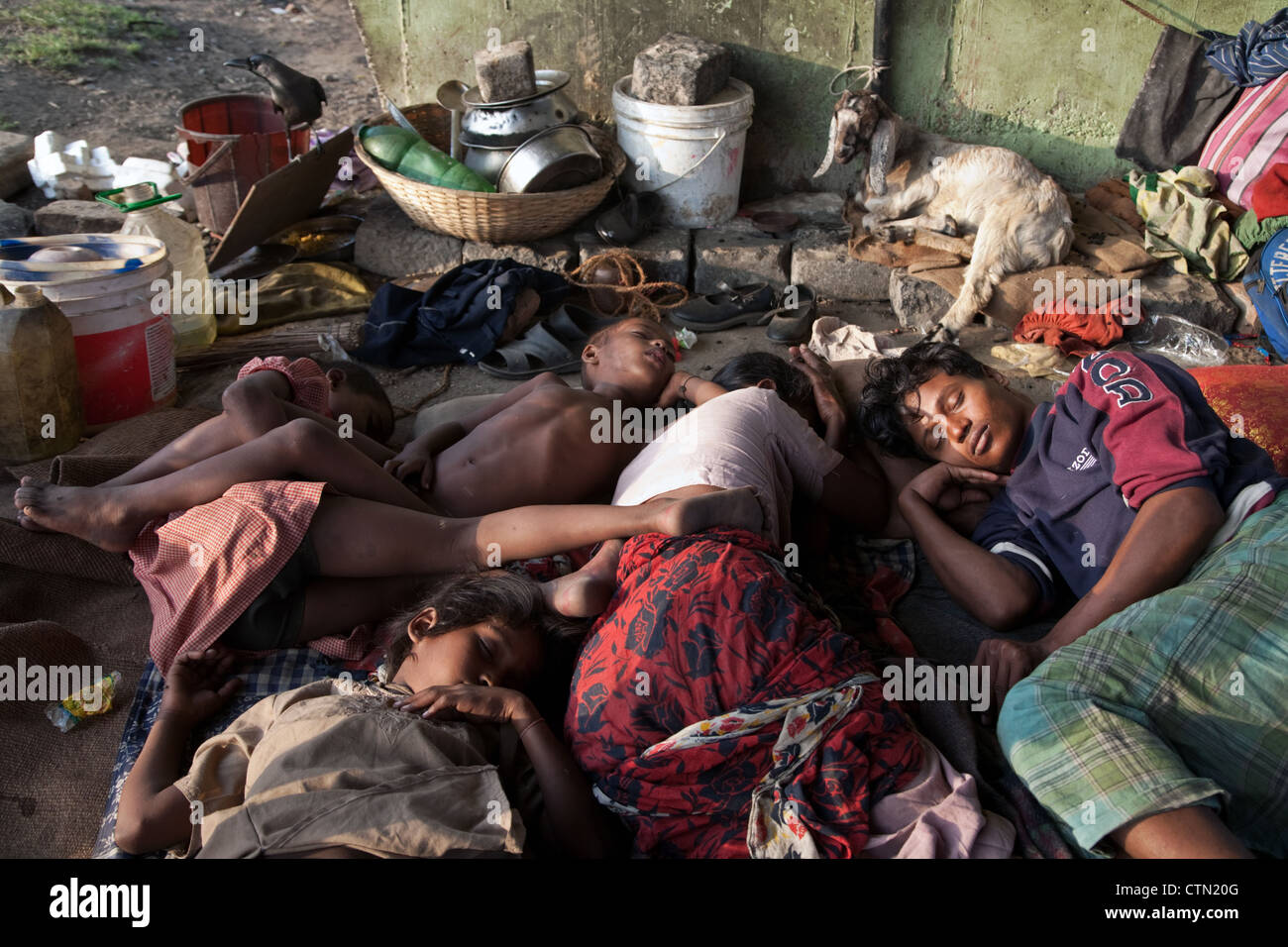 A homeless young family with children sleeping under a bridge in ...