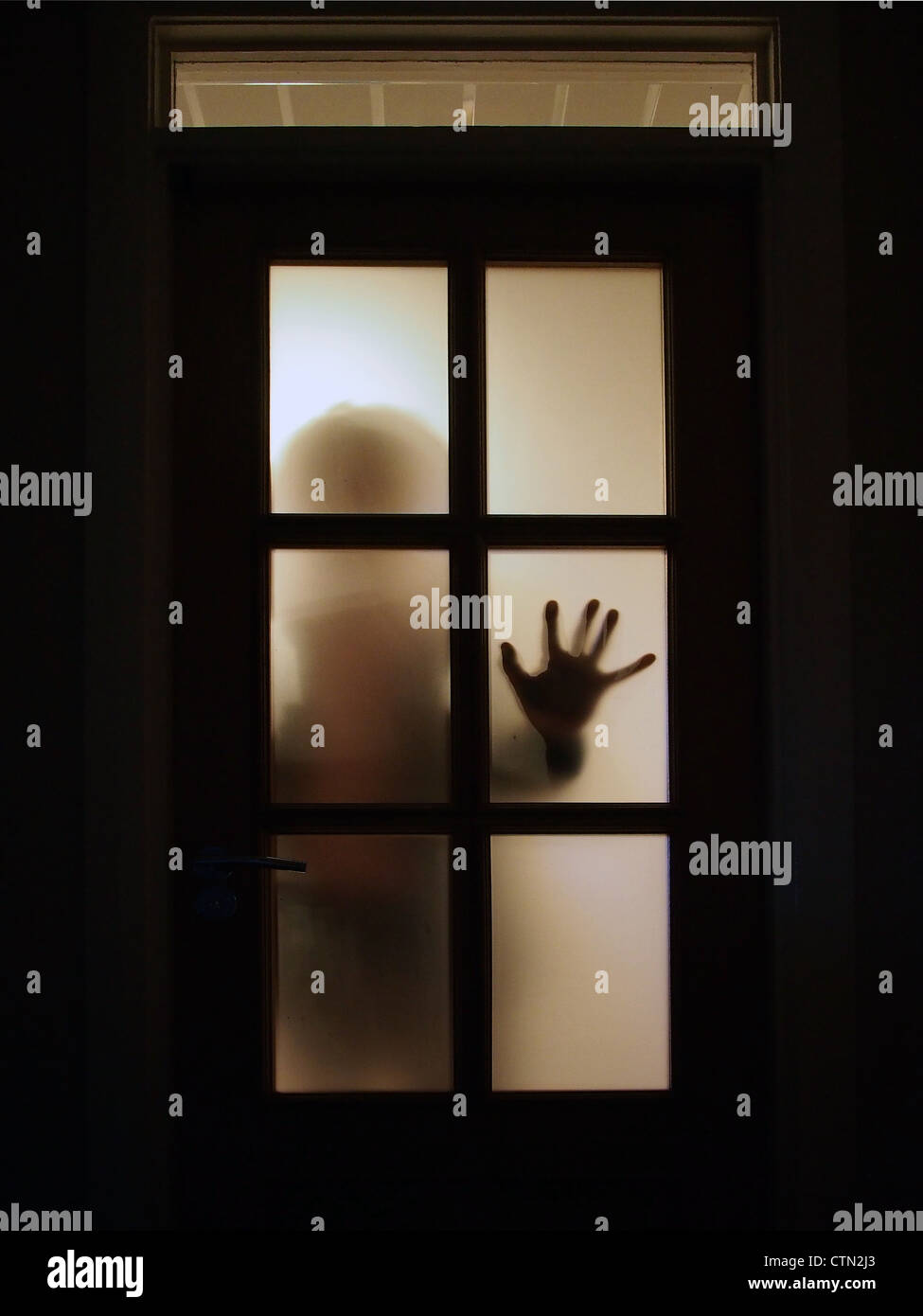 Silhouette of hand on window Stock Photo - Alamy