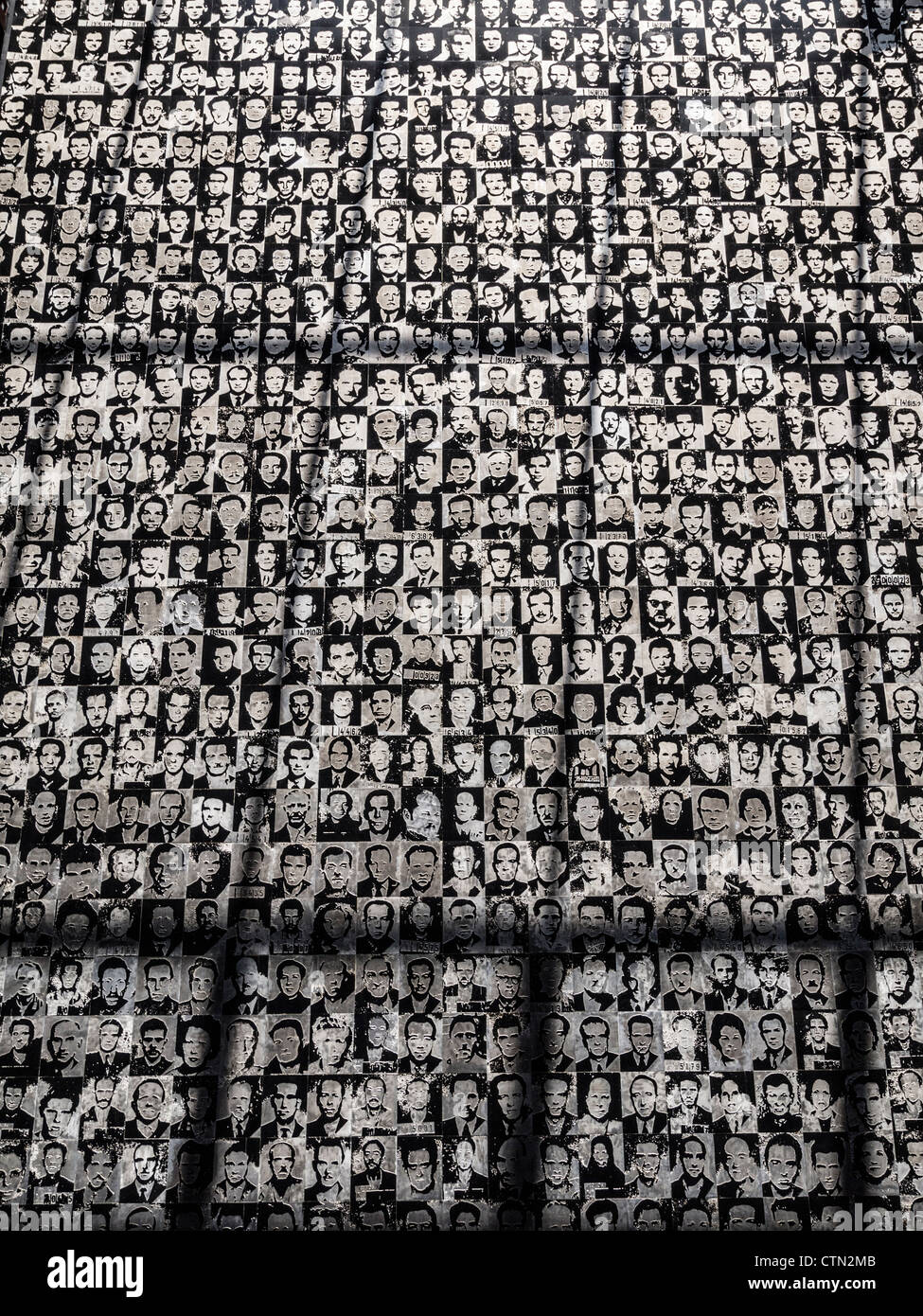 Wall with pictures of former nazi and communist regimes prisoners in ...