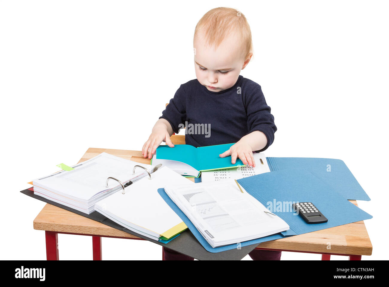 young child working at writing desk in light background Stock Photo - Alamy