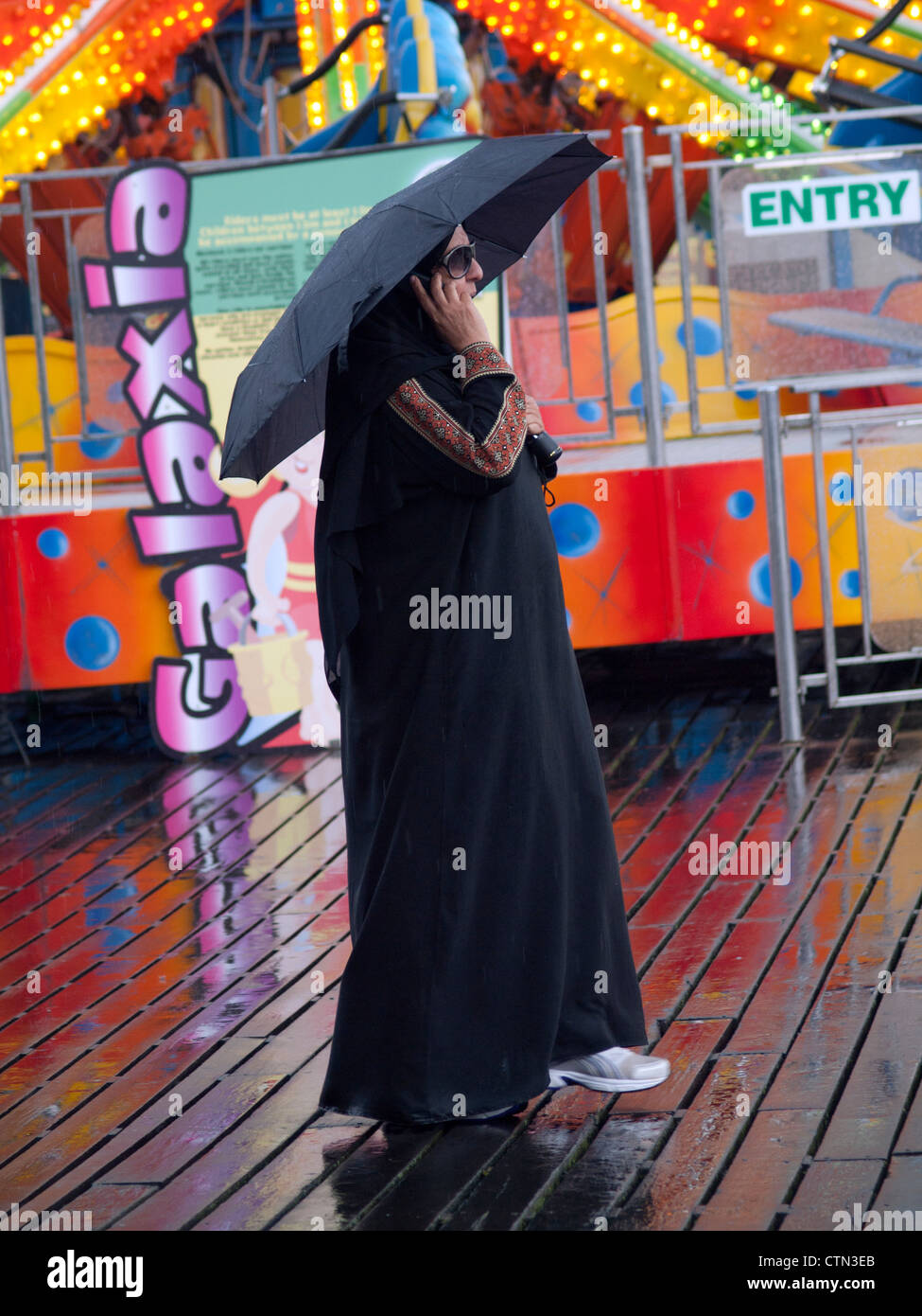 A wet summers day on the pier at Brighton Stock Photo - Alamy