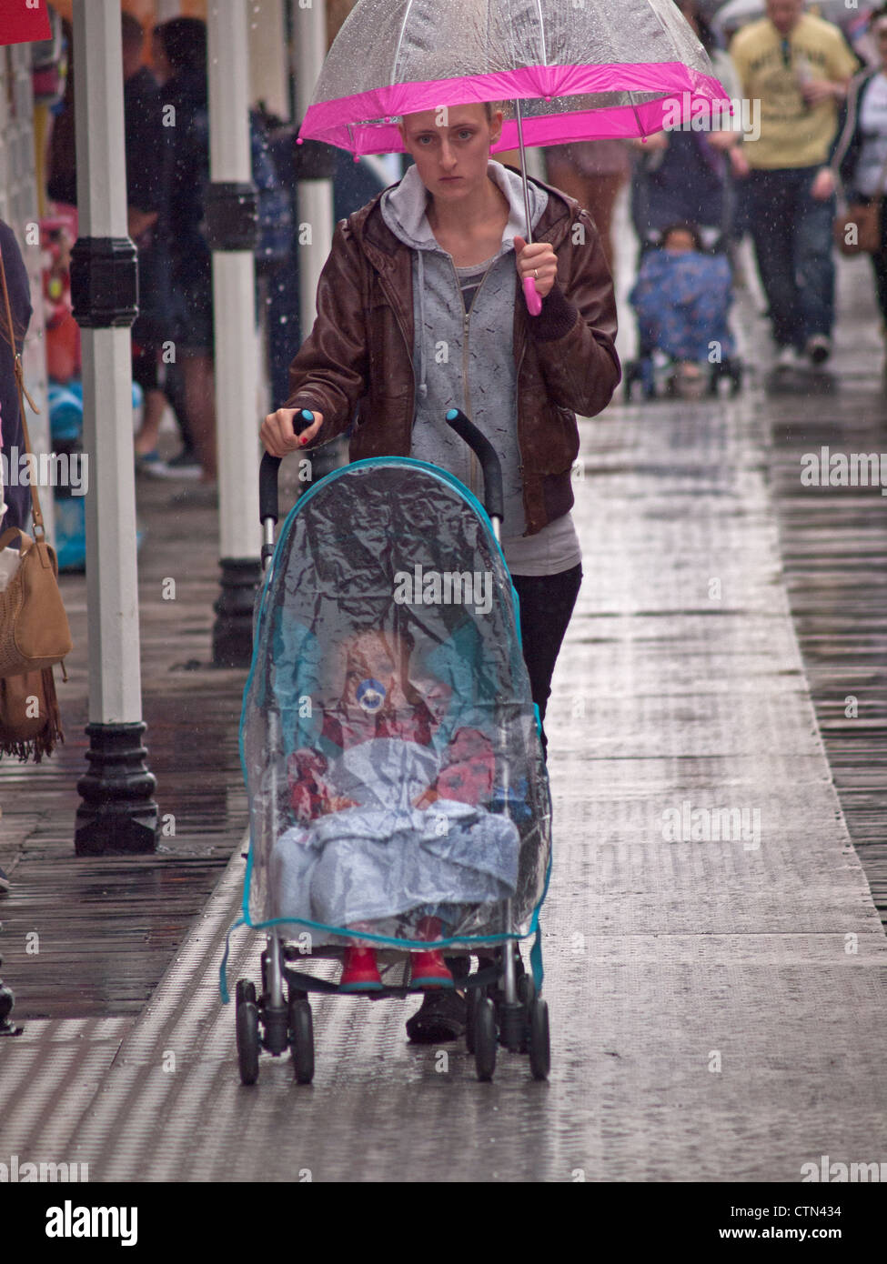 A wet summers day on the pier at Brighton Stock Photo - Alamy