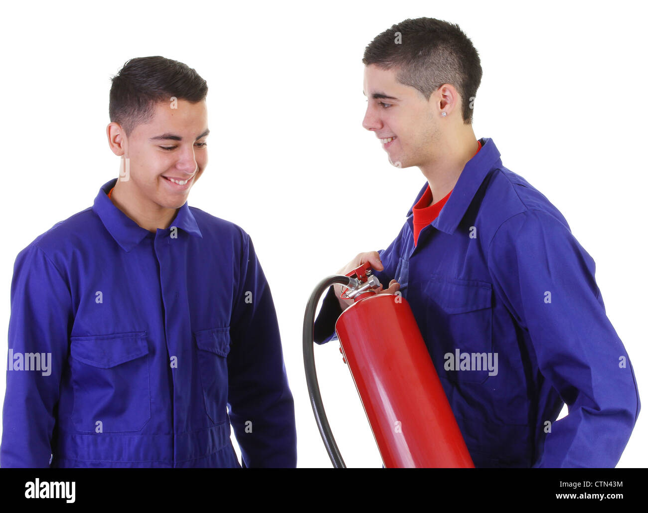 Two guys with a fire extinguisher Stock Photo - Alamy