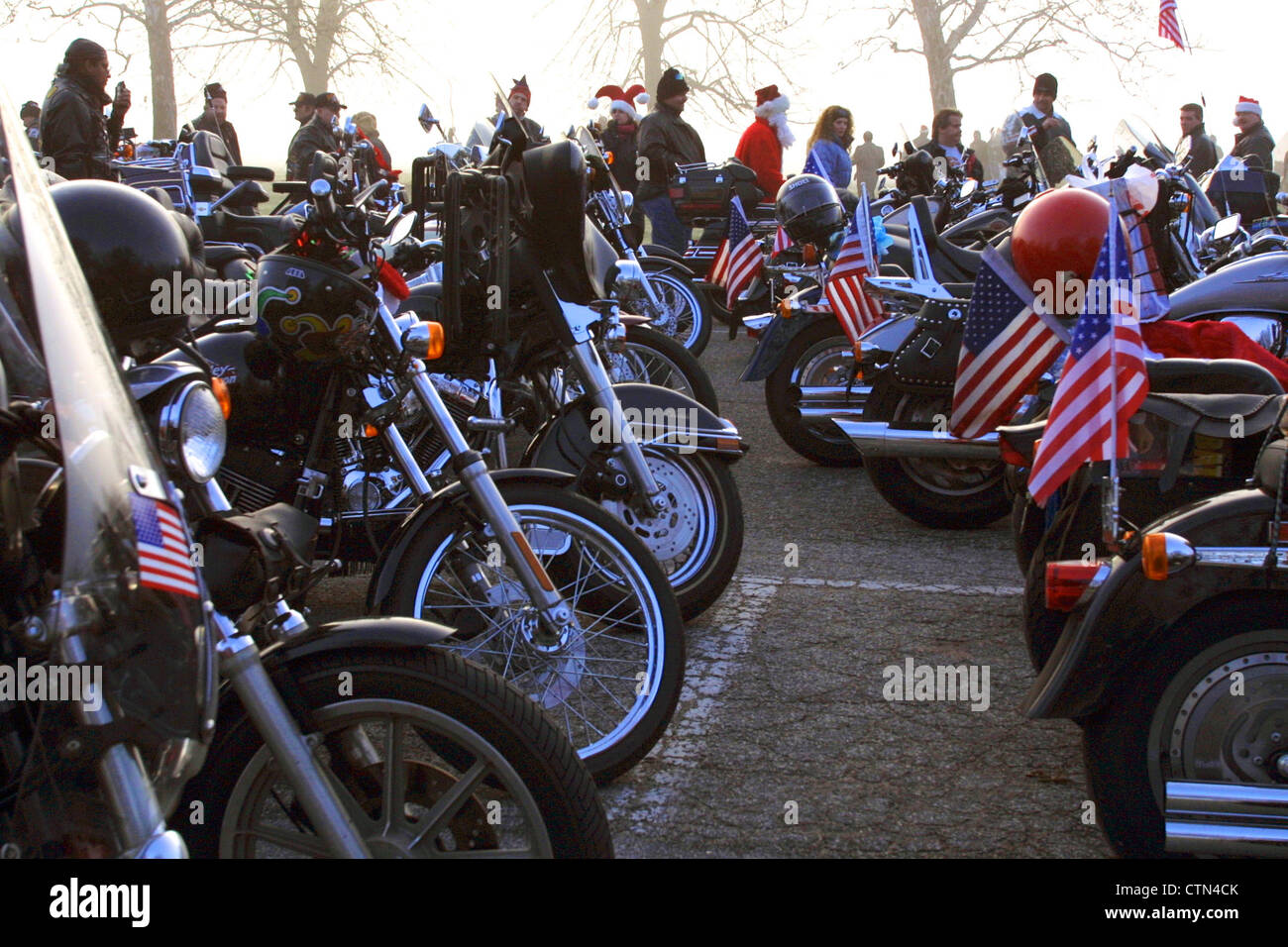 Motorcyclists line up with their motorcycles prior to the start of the ...
