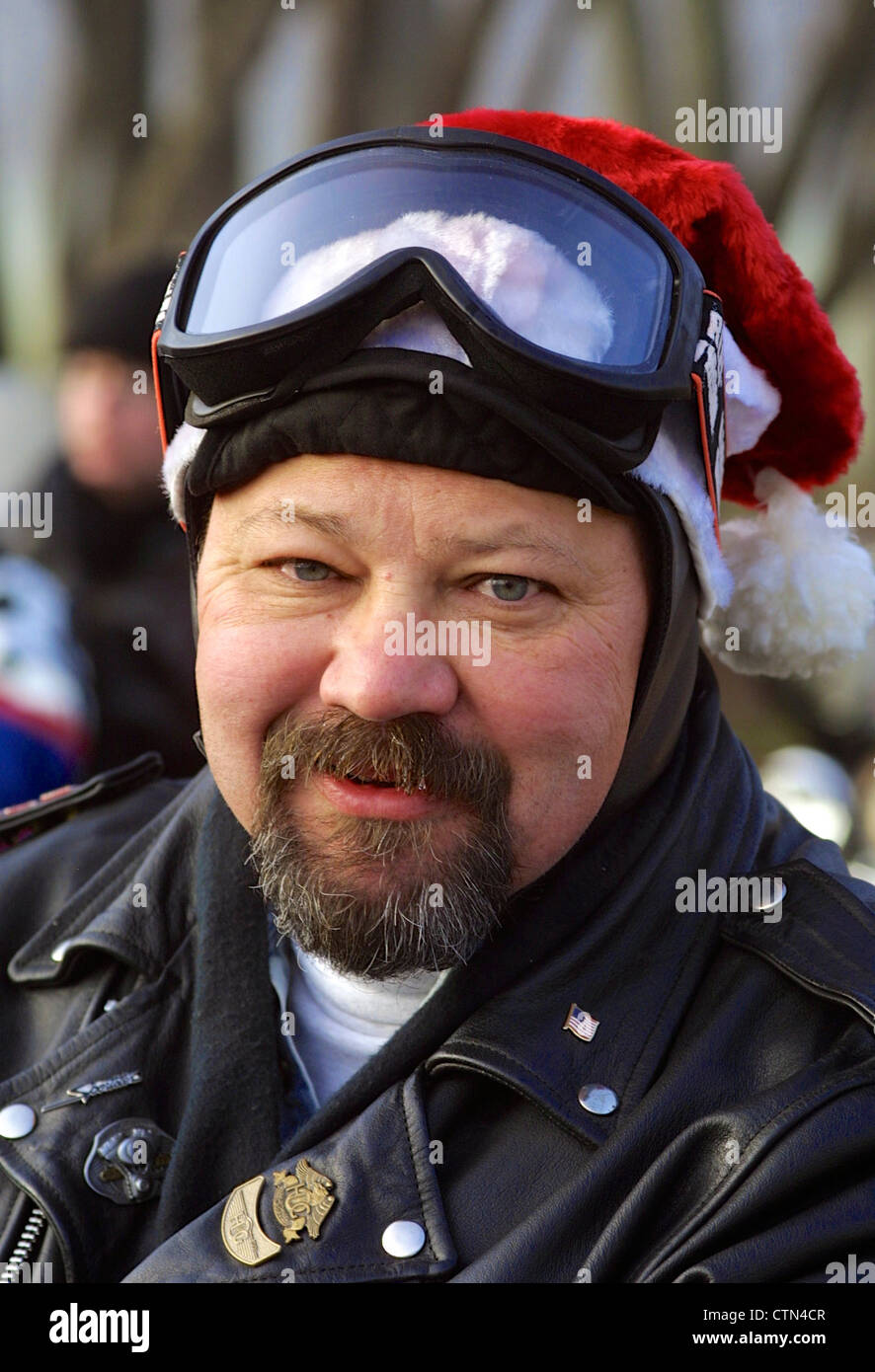 A biker wears a Santa Claus hat pictured before the start of the Toys ...