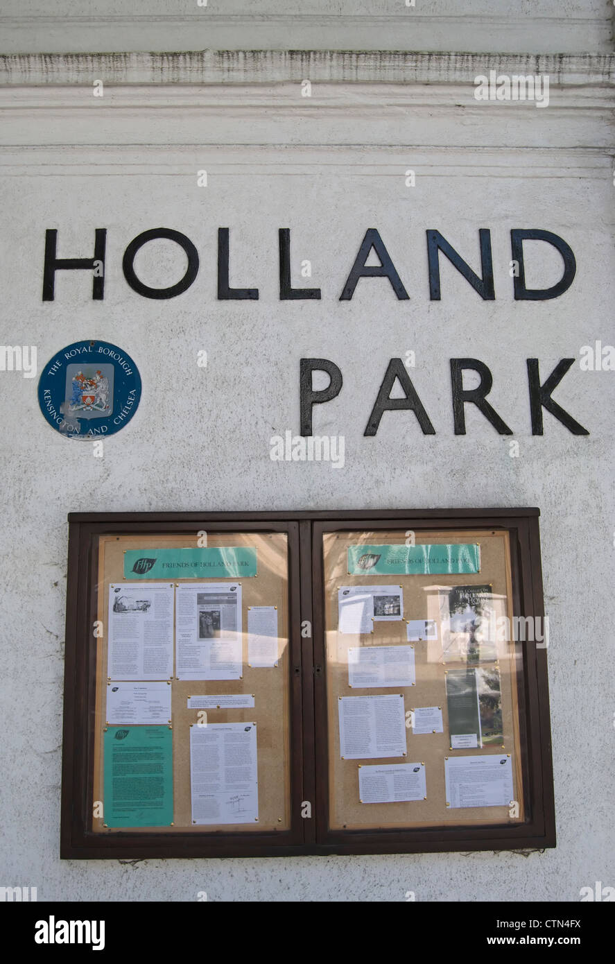 noticeboard, council logo and park name on a wall of holland park ...