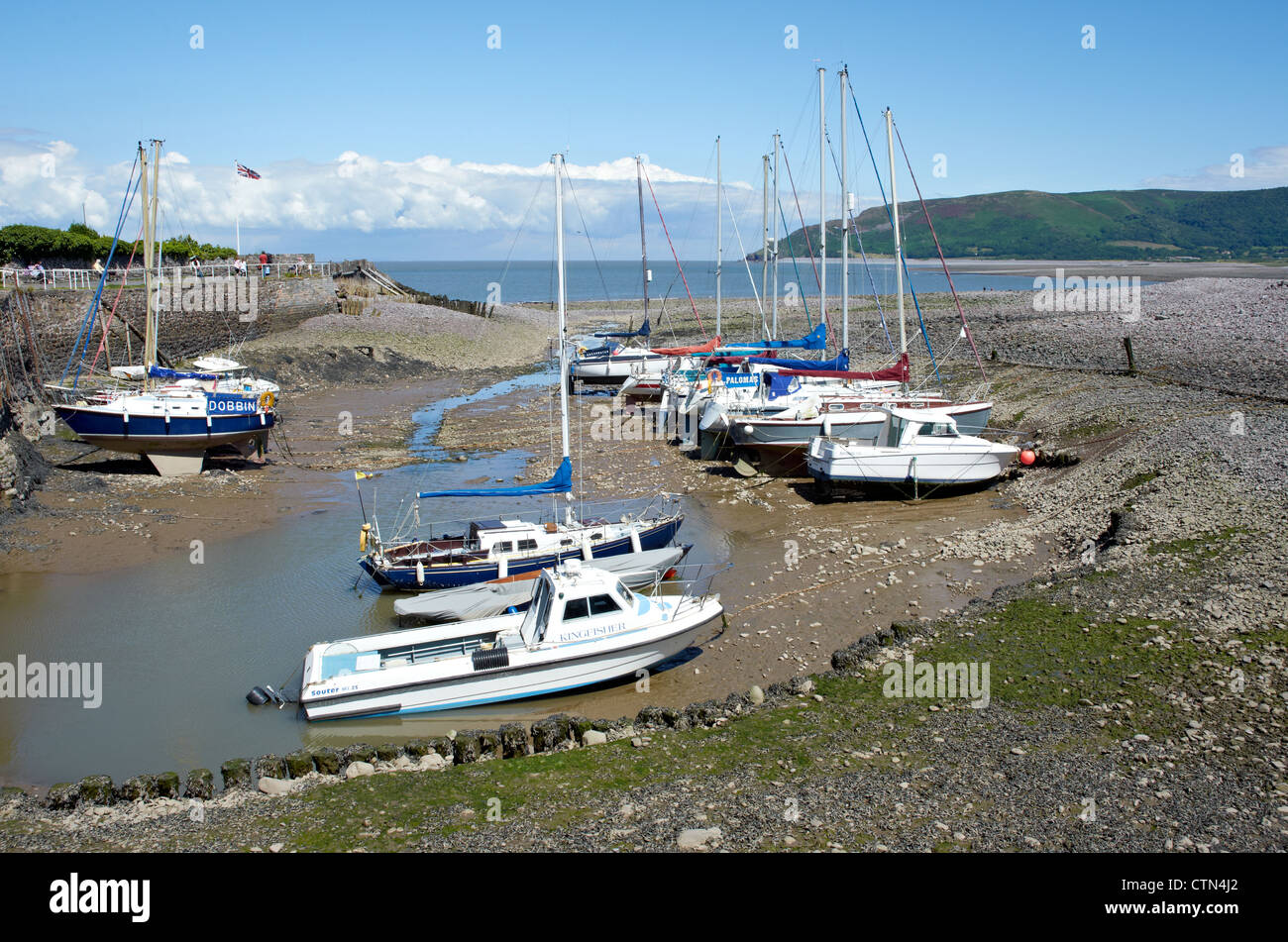 Porlock Weir harbour in Somerset, England at low tide on a summer's day ...