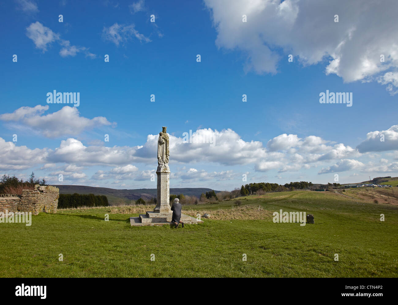 Pilgrim praying, at 'Our Lady of Penrhys' Statue, Penrhys, South Wales ...