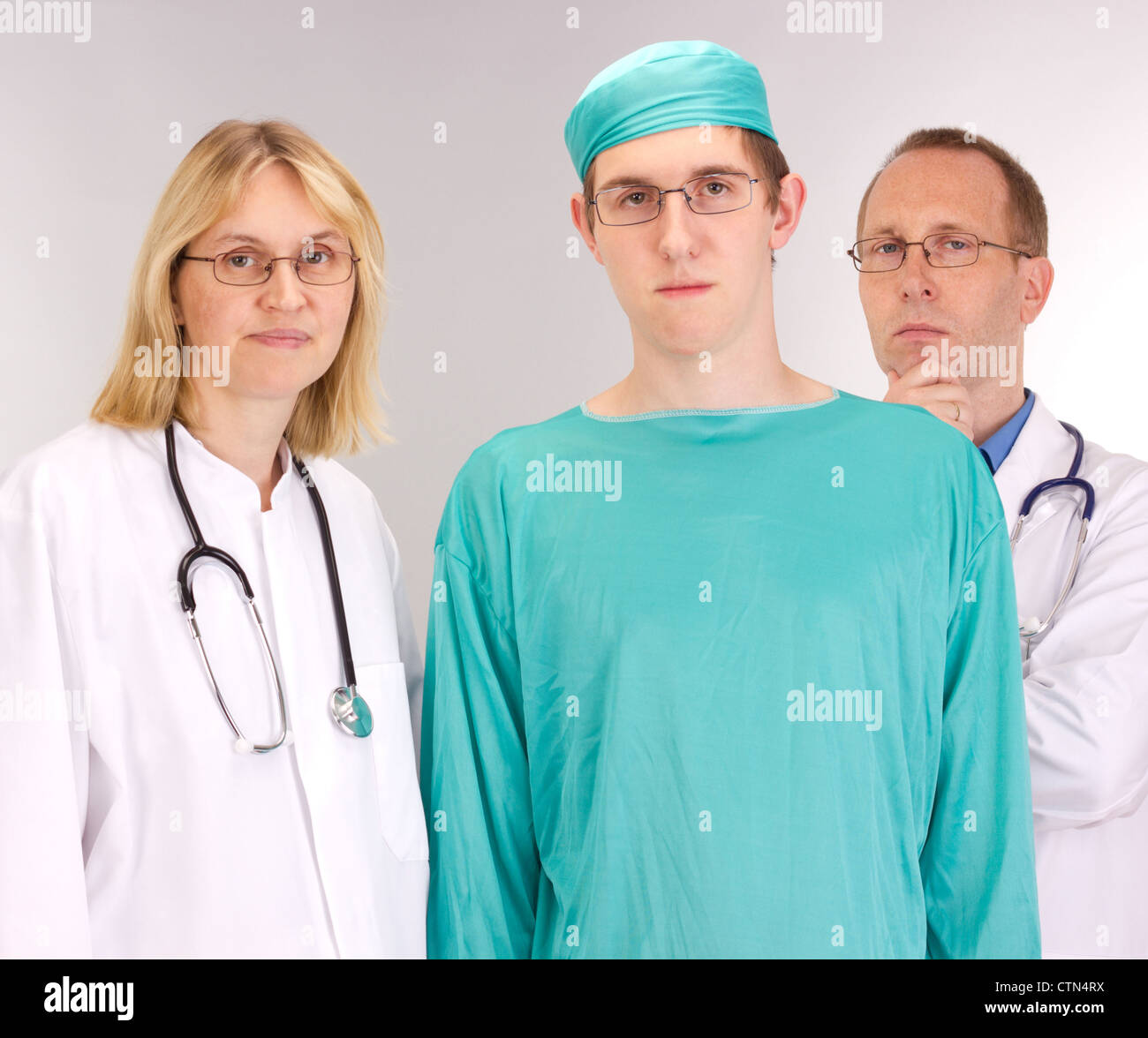 Team consisting of three medical doctors Stock Photo - Alamy