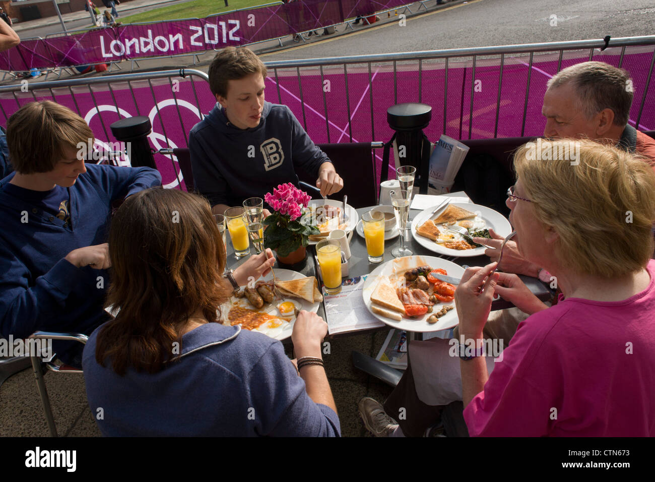 Spectators enjoy a full English breakfast on the first day of ...