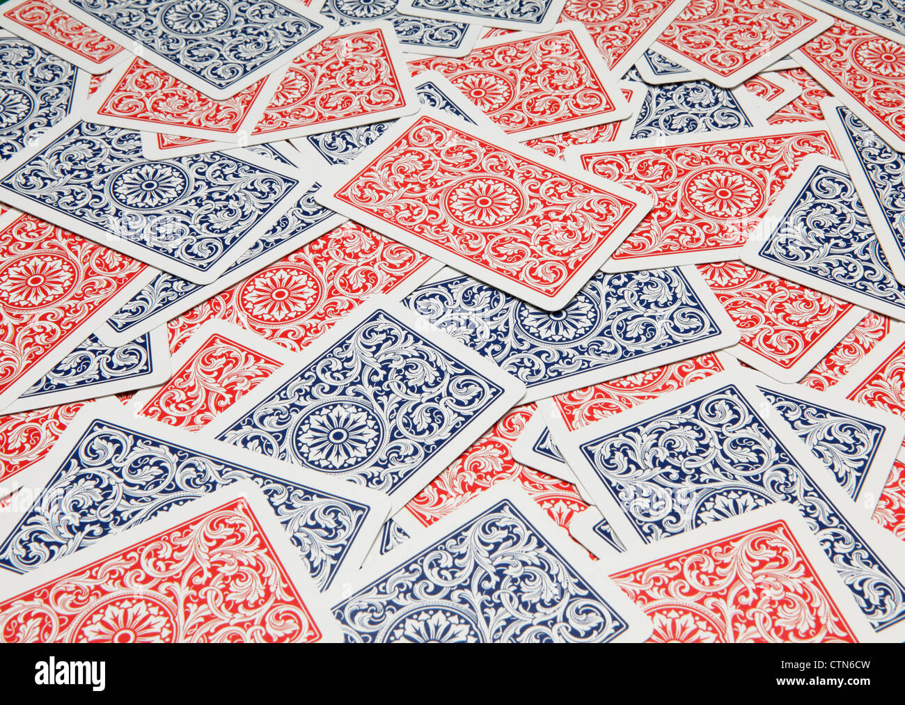 Playing cards on a green table Stock Photo - Alamy