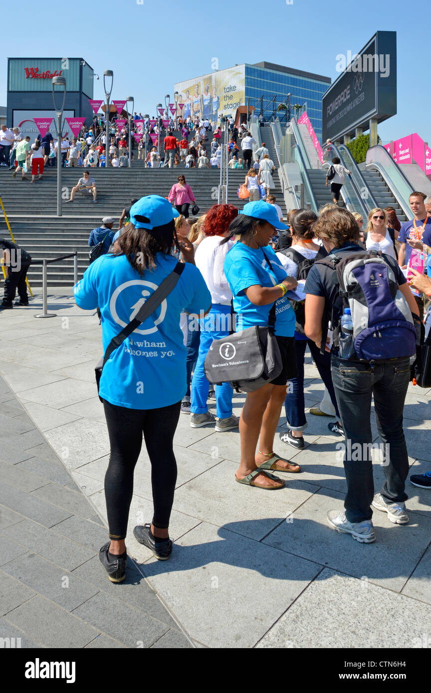 Volunteer helpers in blue uniforms at Westfield & 2012 Olympic Park ...