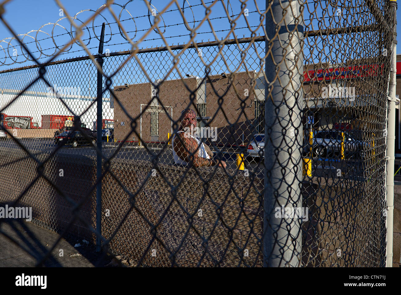 man behind fence in downtown la Stock Photo - Alamy