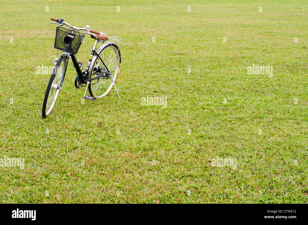 Bicycle on grass field, relaxed concepts with copy space Stock Photo ...