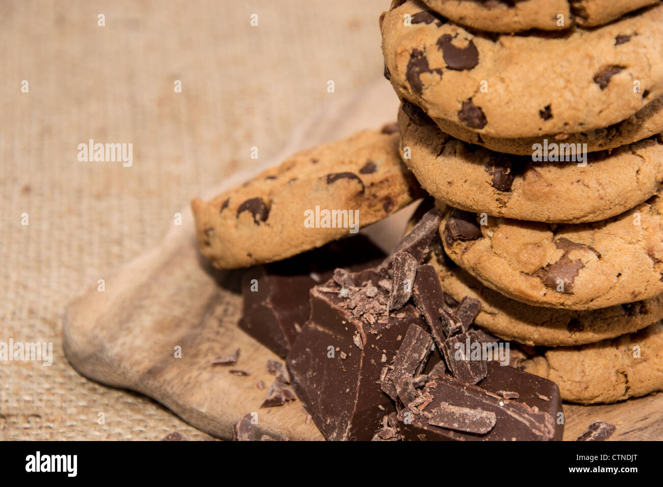 Stacked Cookies with Chocolate on a rustic background Stock Photo - Alamy