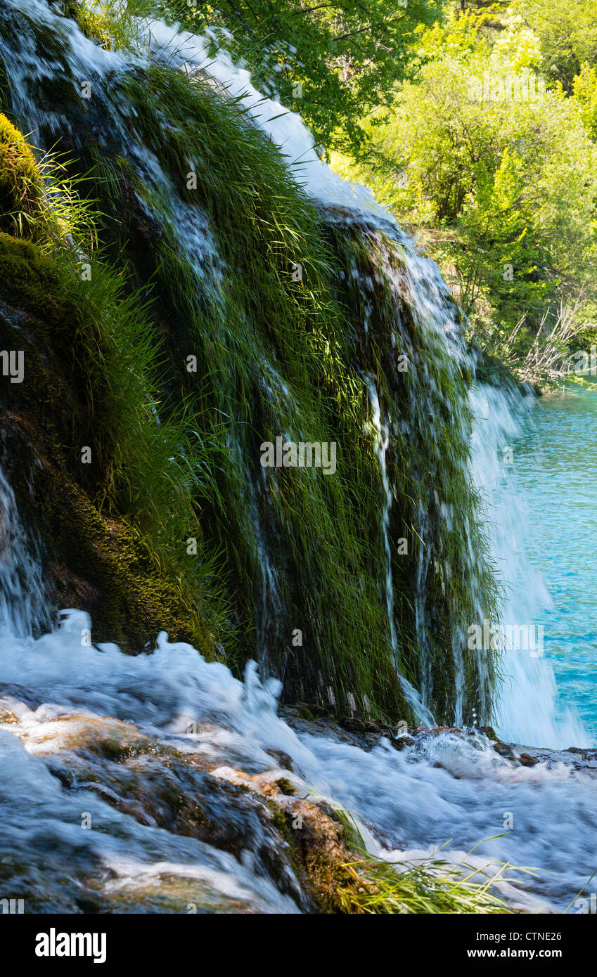 Small waterfall and azure lake in Plitvice Lakes National Park (Croatia ...