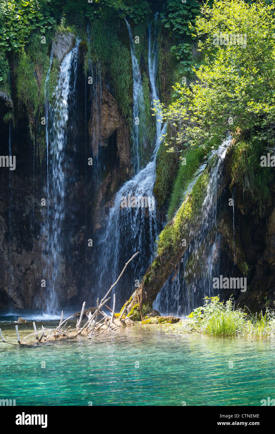 Beautiful waterfall and sea-green limpid lake in Plitvice Lakes ...