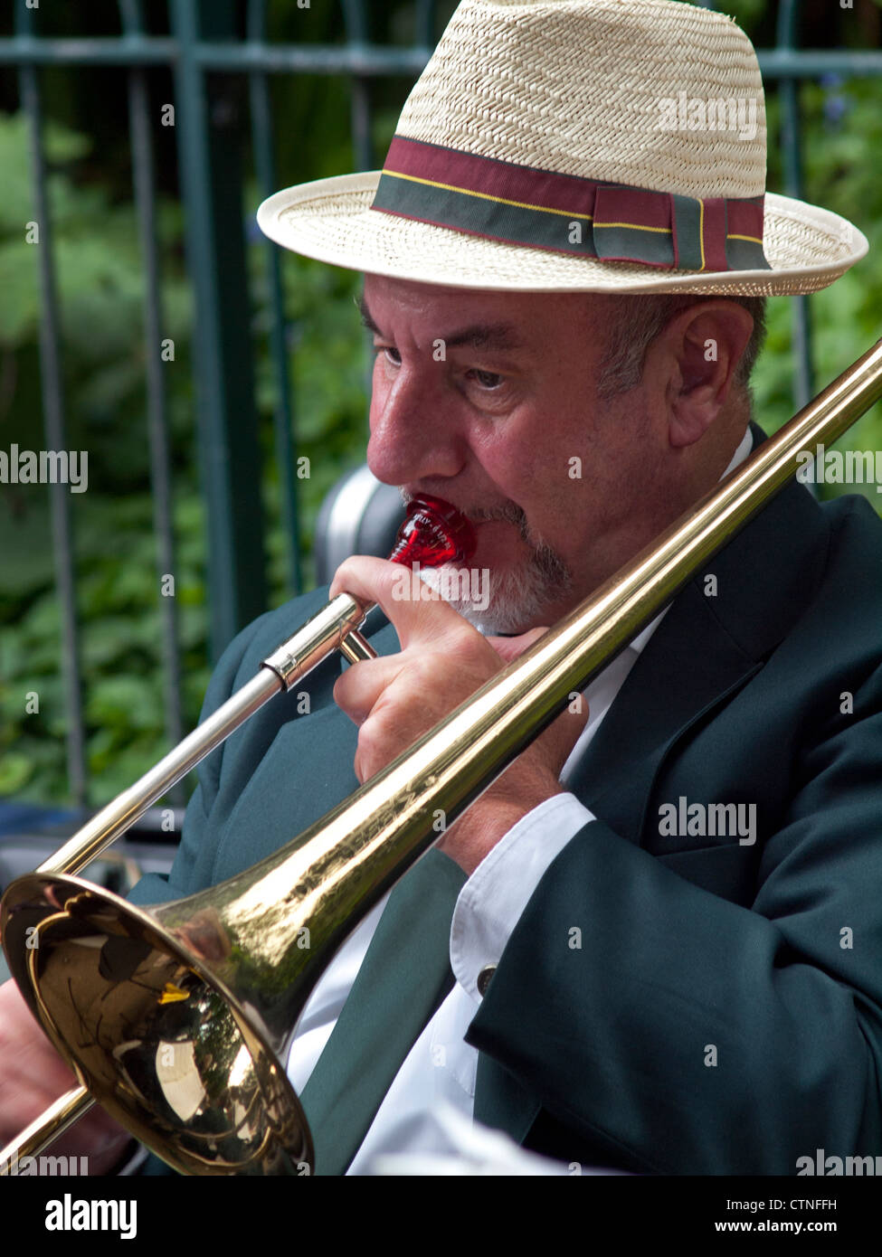 In Pavilion Gardens,Brighton a jazz man plays his trombone Stock Photo ...