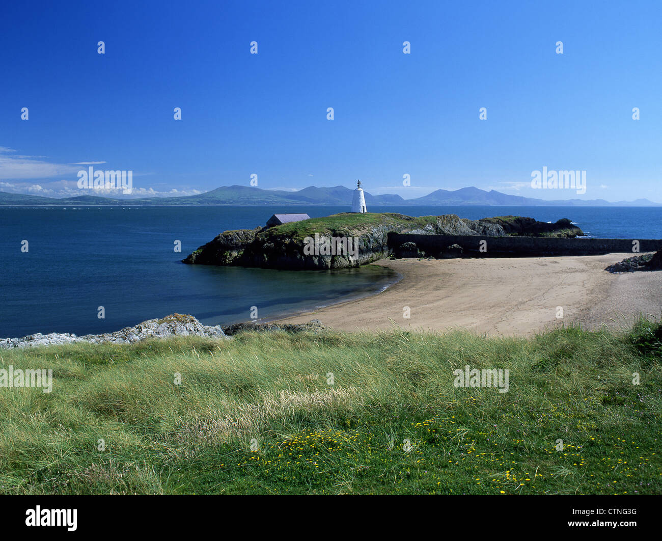 Llanddwyn Island Beach and old lighthouse, view across Caernarfon Bay ...