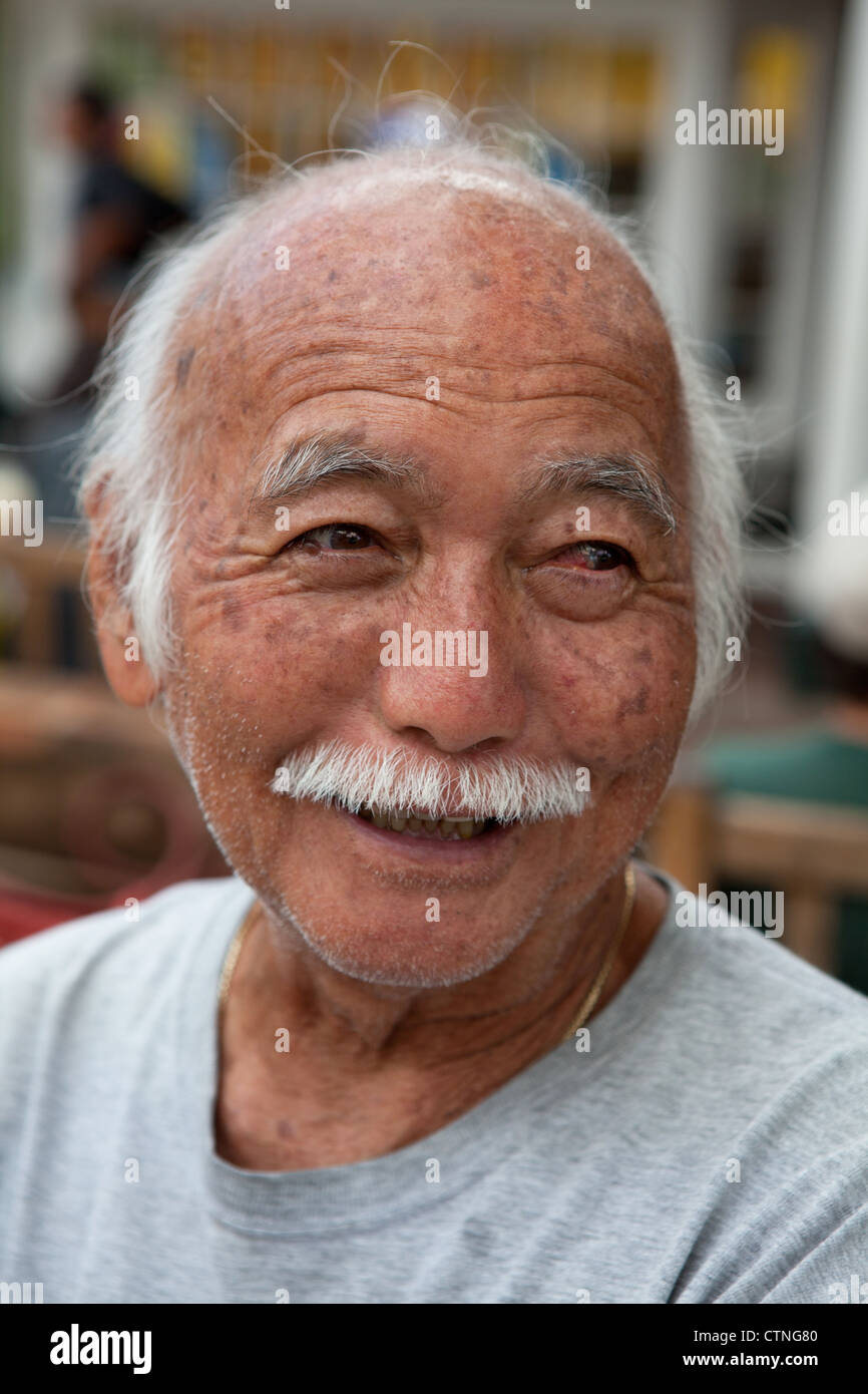 Japanese-American, native Hawaiian elderly man smiling, closeup Stock ...