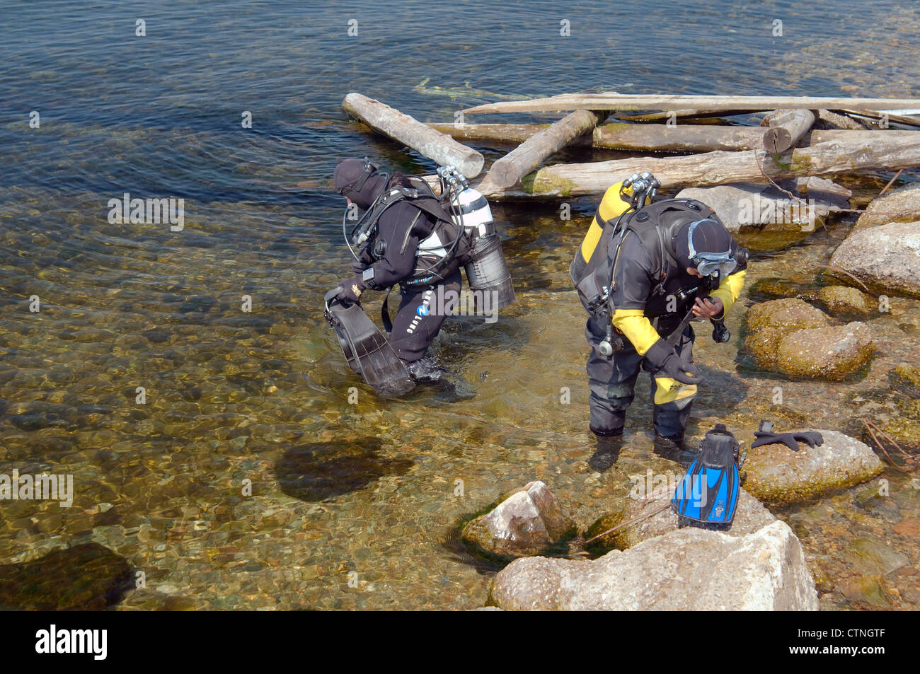 diver prepares to diving in Baikal lake, Siberia, Russian Federation ...