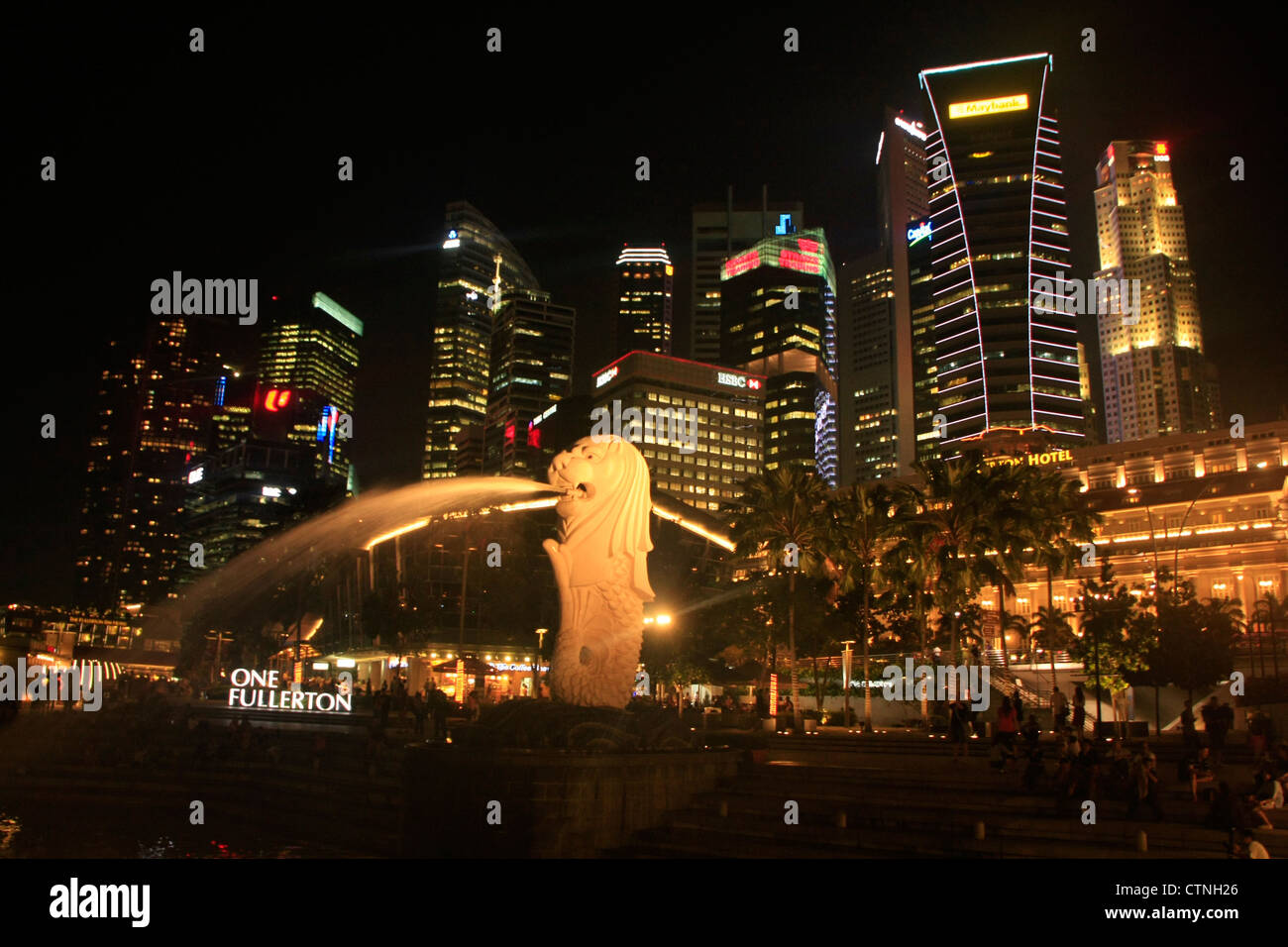 Merlion statue and skyline at night, Singapore Stock Photo - Alamy