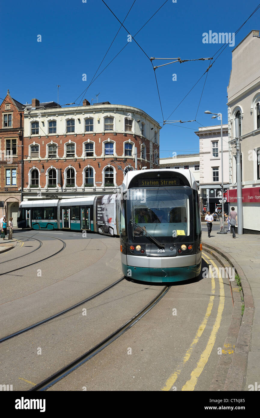 nottingham express transit tram turning the corner of victoria street ...