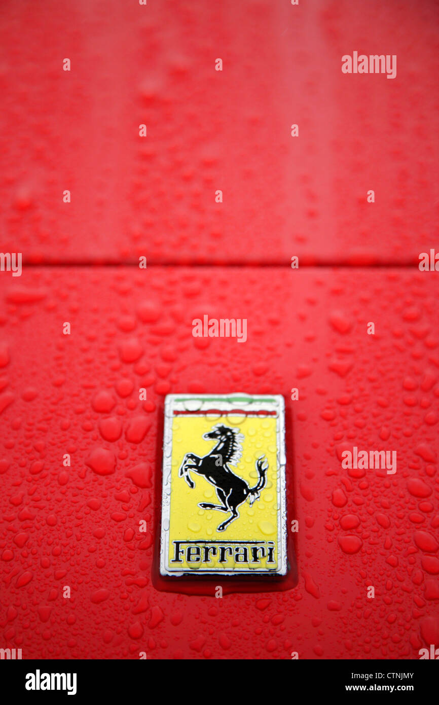 Badge on red Ferrari sportscar Stock Photo - Alamy