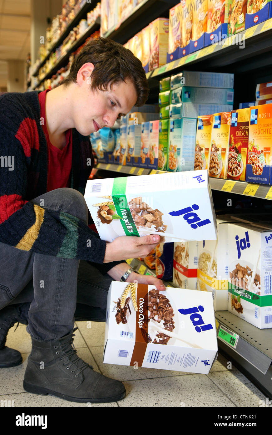 Shopping in a large supermarket. Different products Stock Photo - Alamy