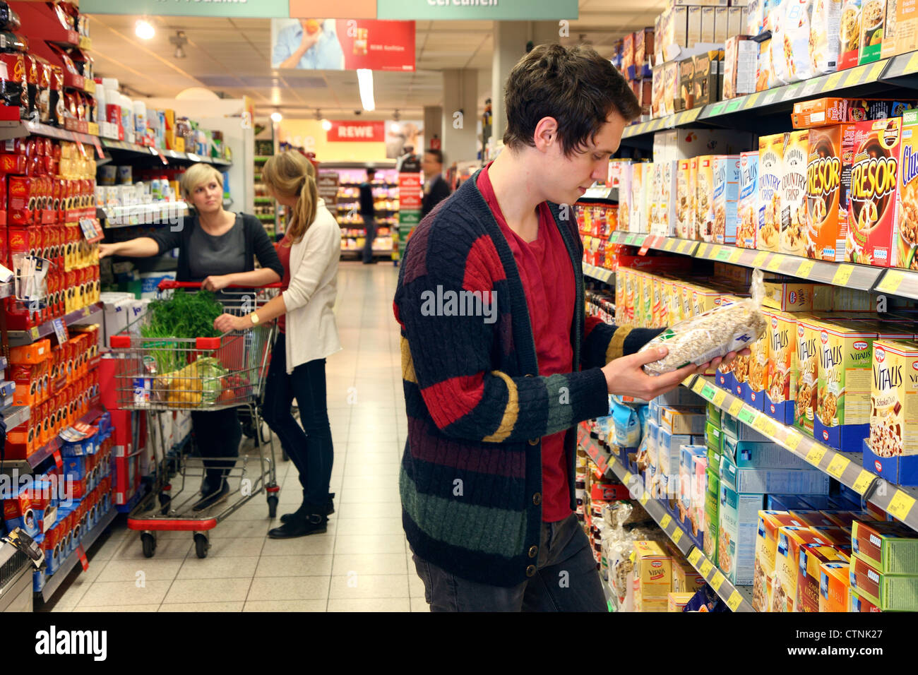 Shopping in a large supermarket. Different products Stock Photo - Alamy