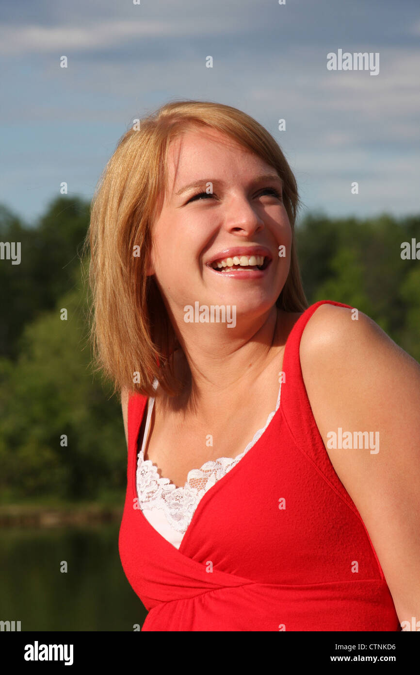 A young girl smiling beside a lake in Wisconsin Stock Photo - Alamy