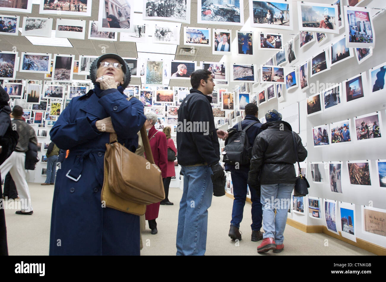 People browse the "Here is New York", photo exhibit in Chicago 2002 ...