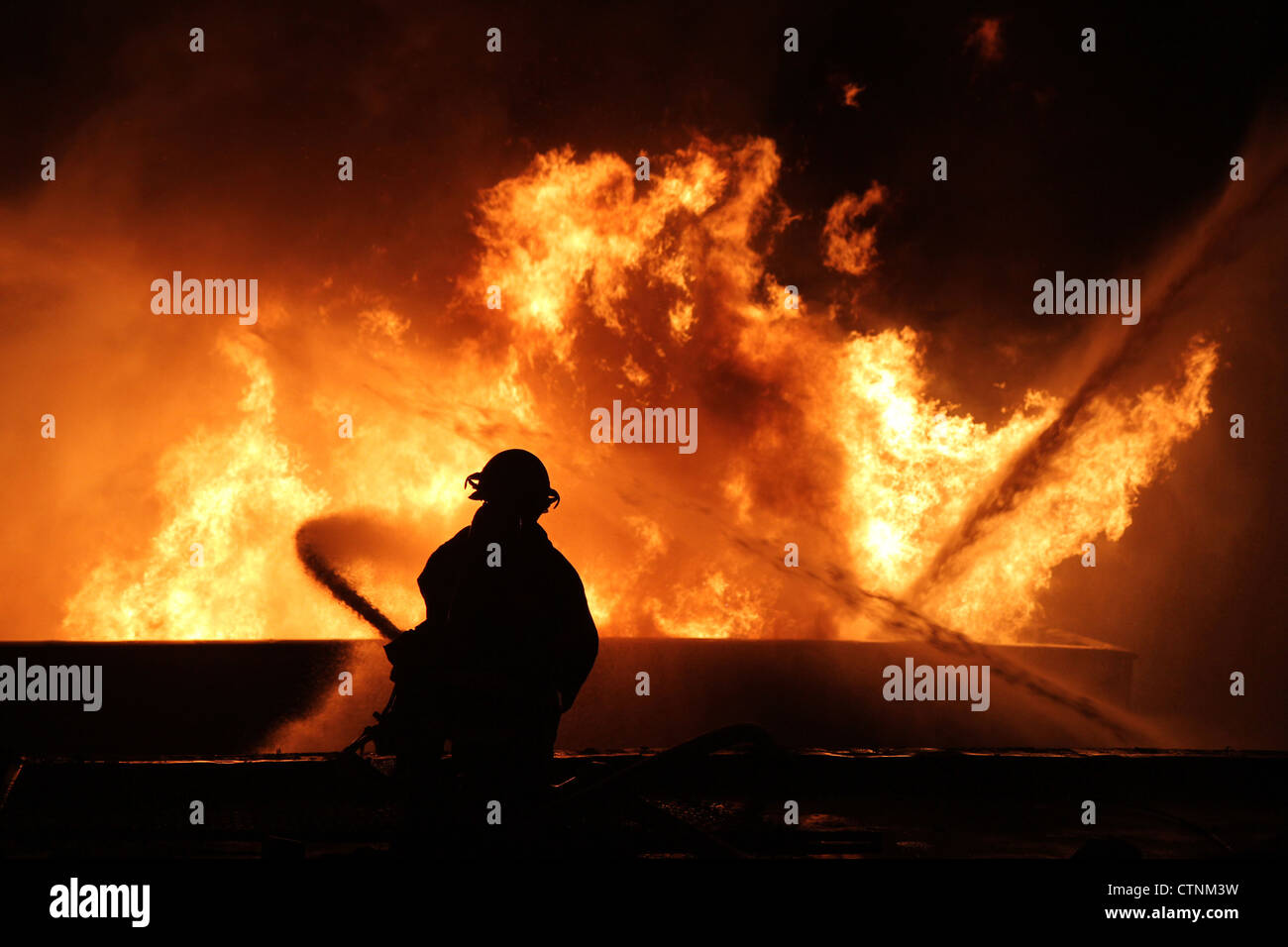 Firefighter at extra or multiple alarm fire, E USA Stock Photo - Alamy