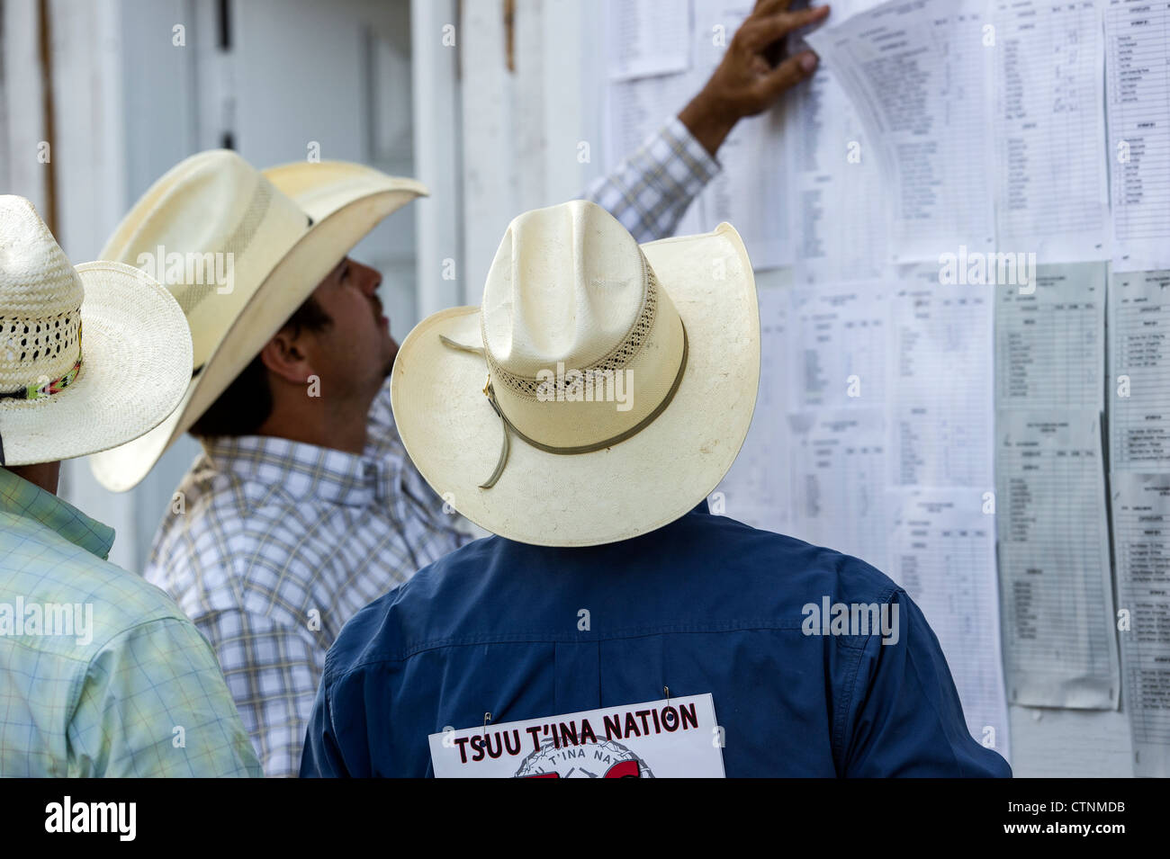 Native rodeo competitors checking results at the Tsuu T'ina Nation's ...