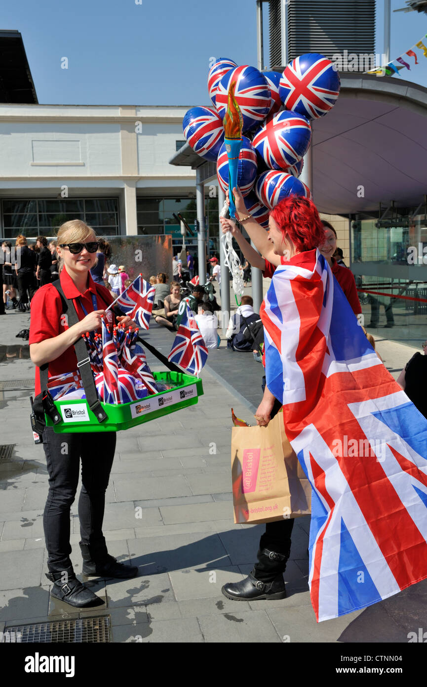 Women wearing Union Jack selling Union Jack balloons another selling ...