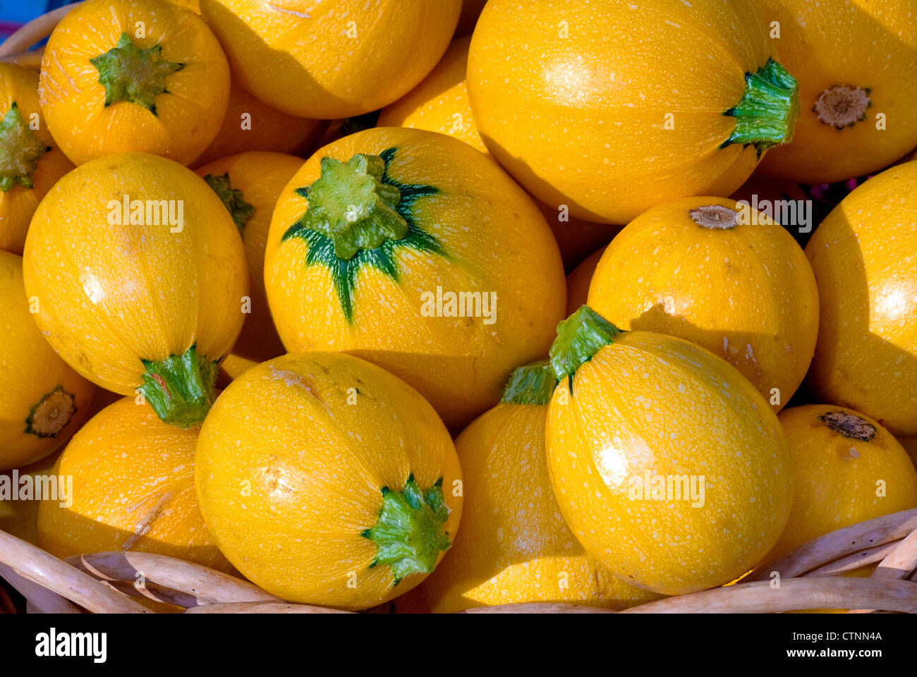 Many small round squash in a basket Stock Photo - Alamy