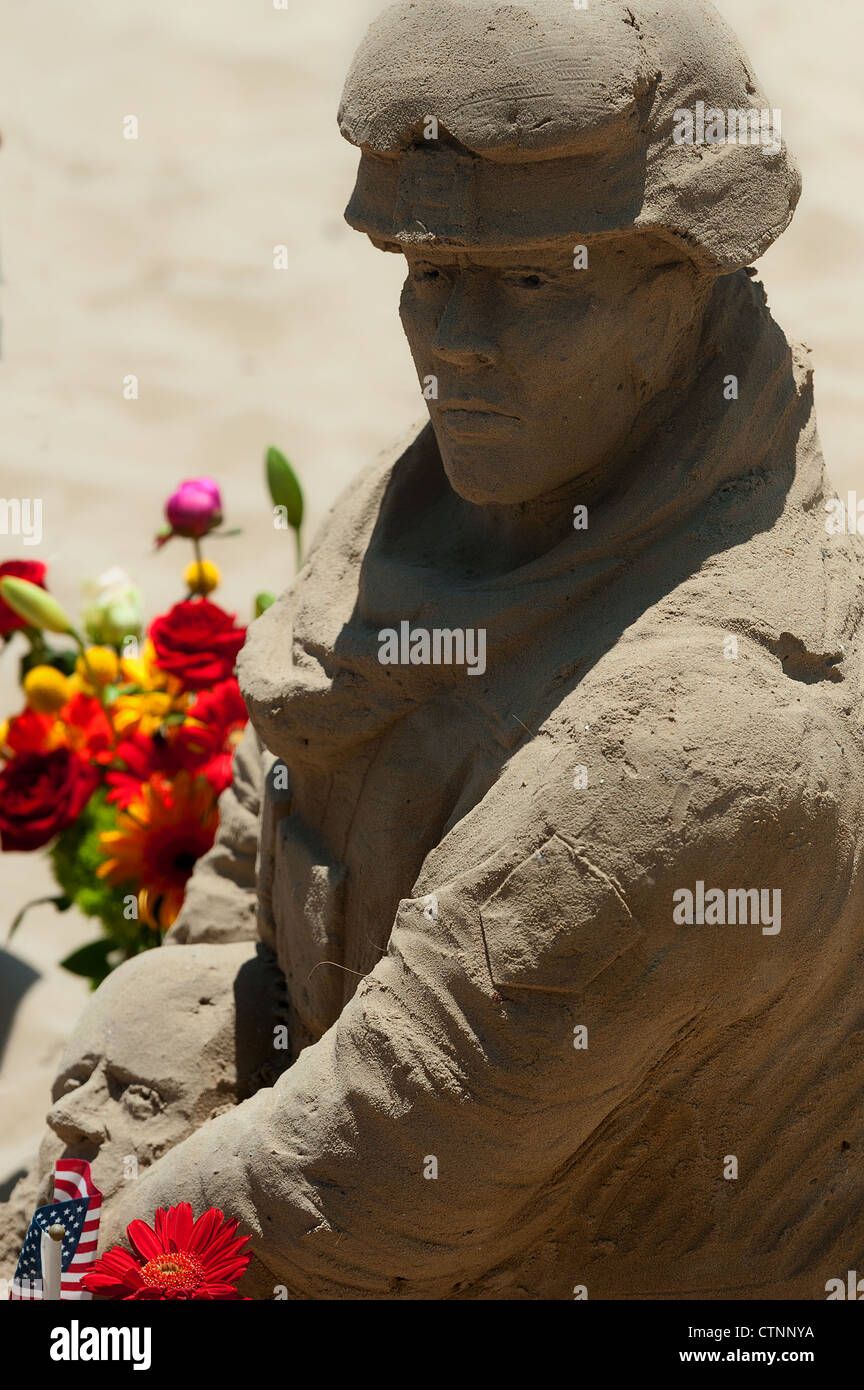 A portrait of a U.S marine made from sand at the Arlington West ...