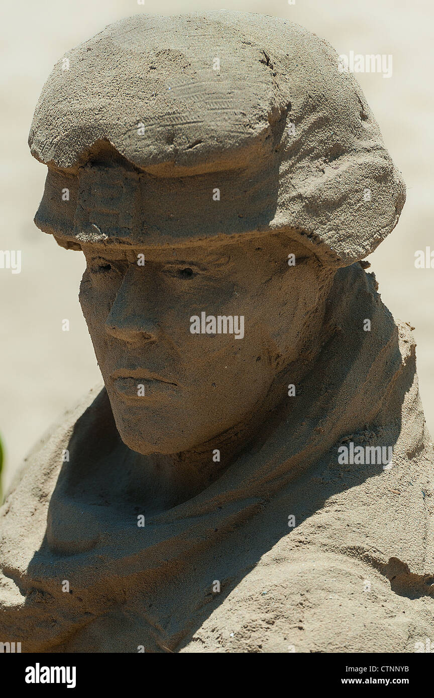 A portrait of a U.S marine made from sand at the Arlington West ...