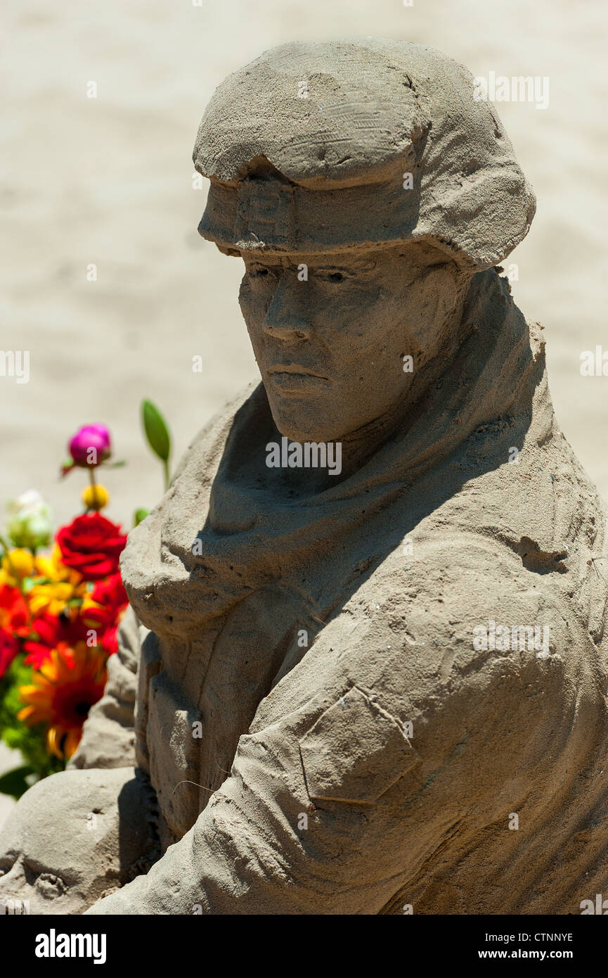A portrait of a U.S marine made from sand at the Arlington West ...