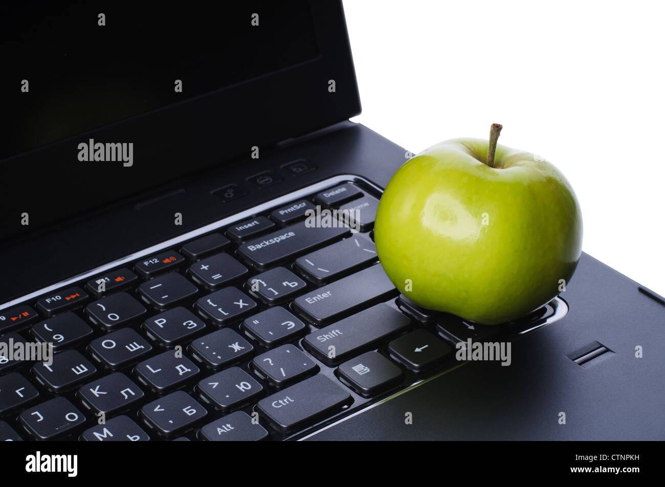 Green apple on laptop keyboard isolated on white background Stock Photo ...
