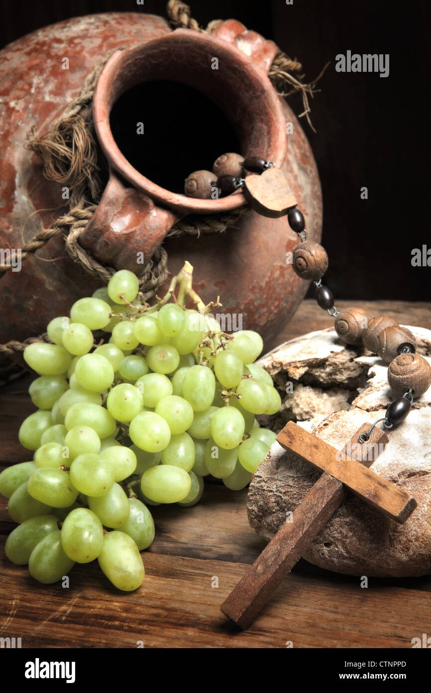 Antique rosary and rustic loaf of bread as christian symbols of faith ...