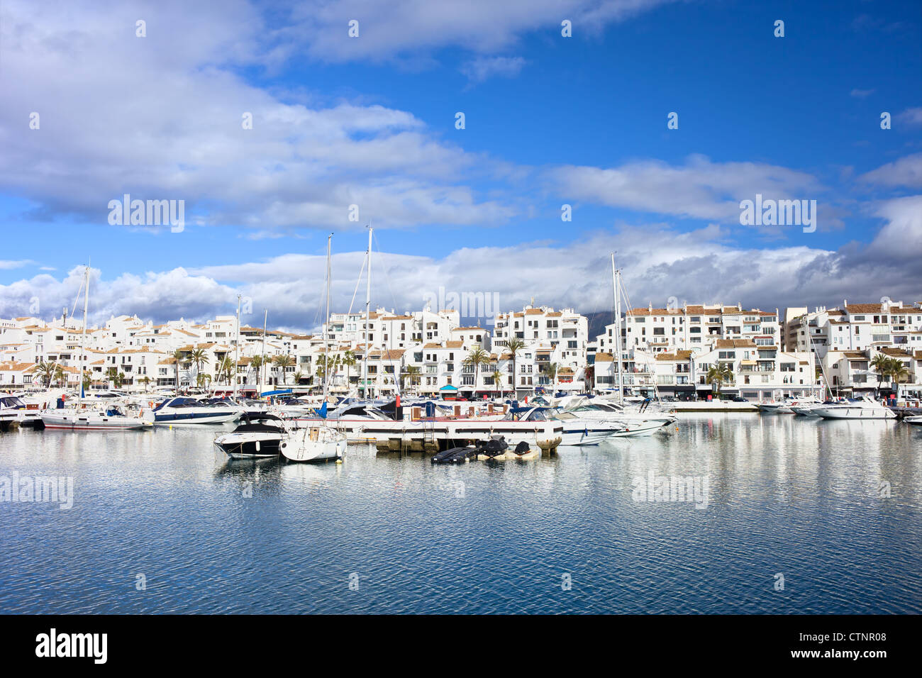 Marina waterfront with luxury motor yachts in holiday resort town of ...